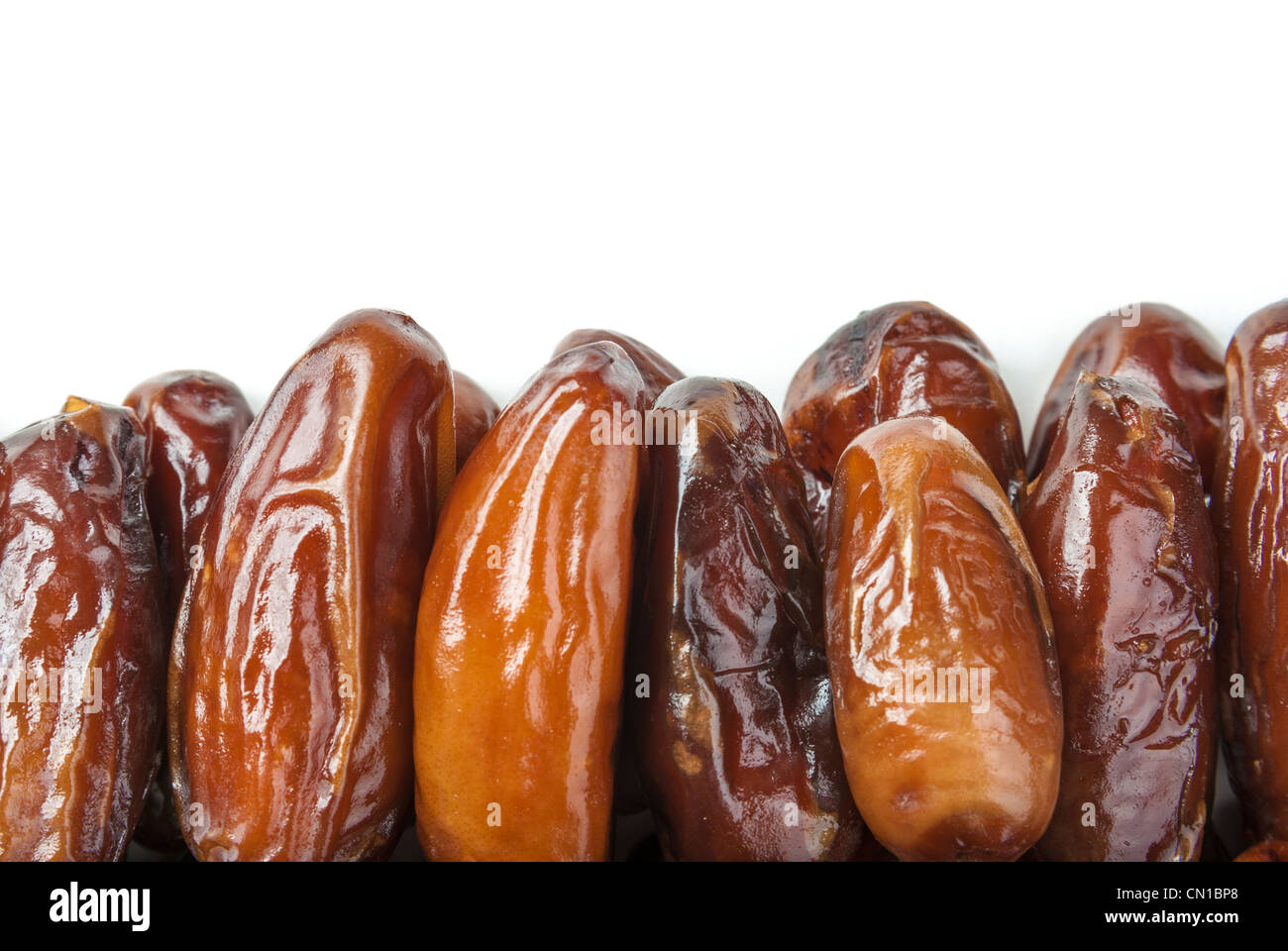A stack of delicious date fruits on a white background Stock Photo - Alamy