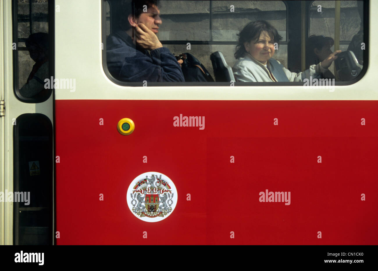 Czech Republic, Prague, city tram, passengers seen through window of ...