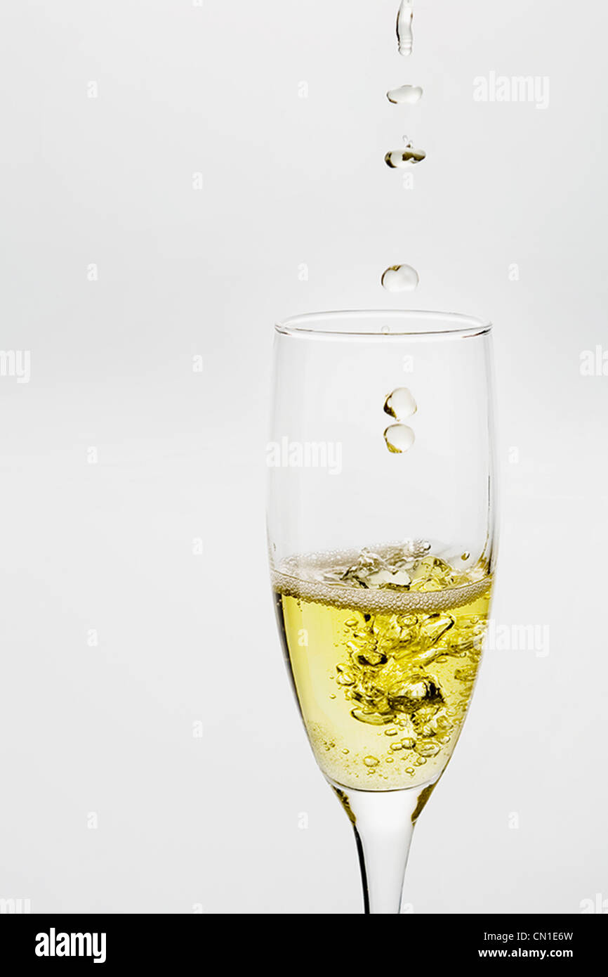 Champagne Dropping into Glass Stock Photo - Alamy