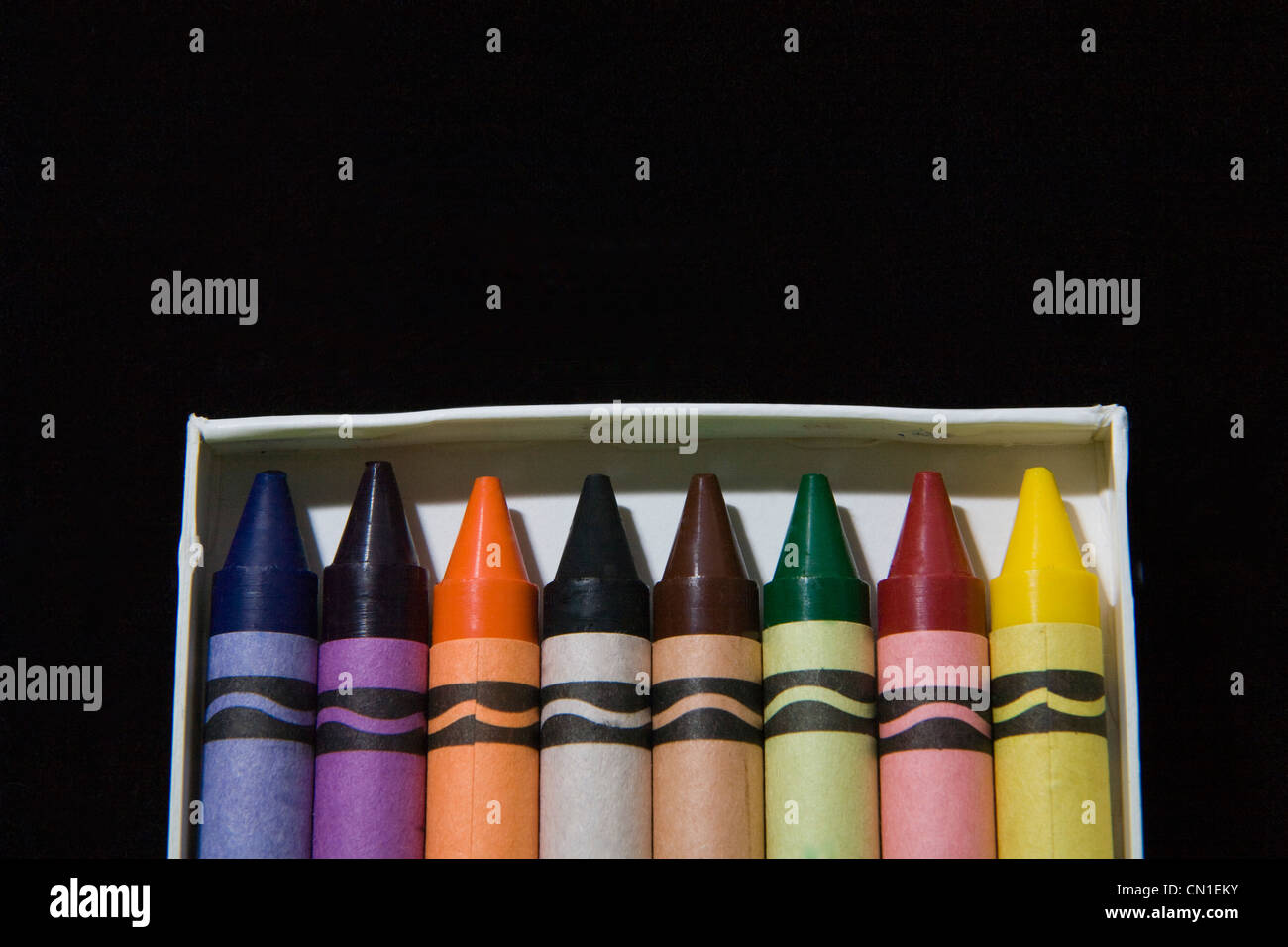 Crayons in Box on Black Background Stock Photo - Alamy