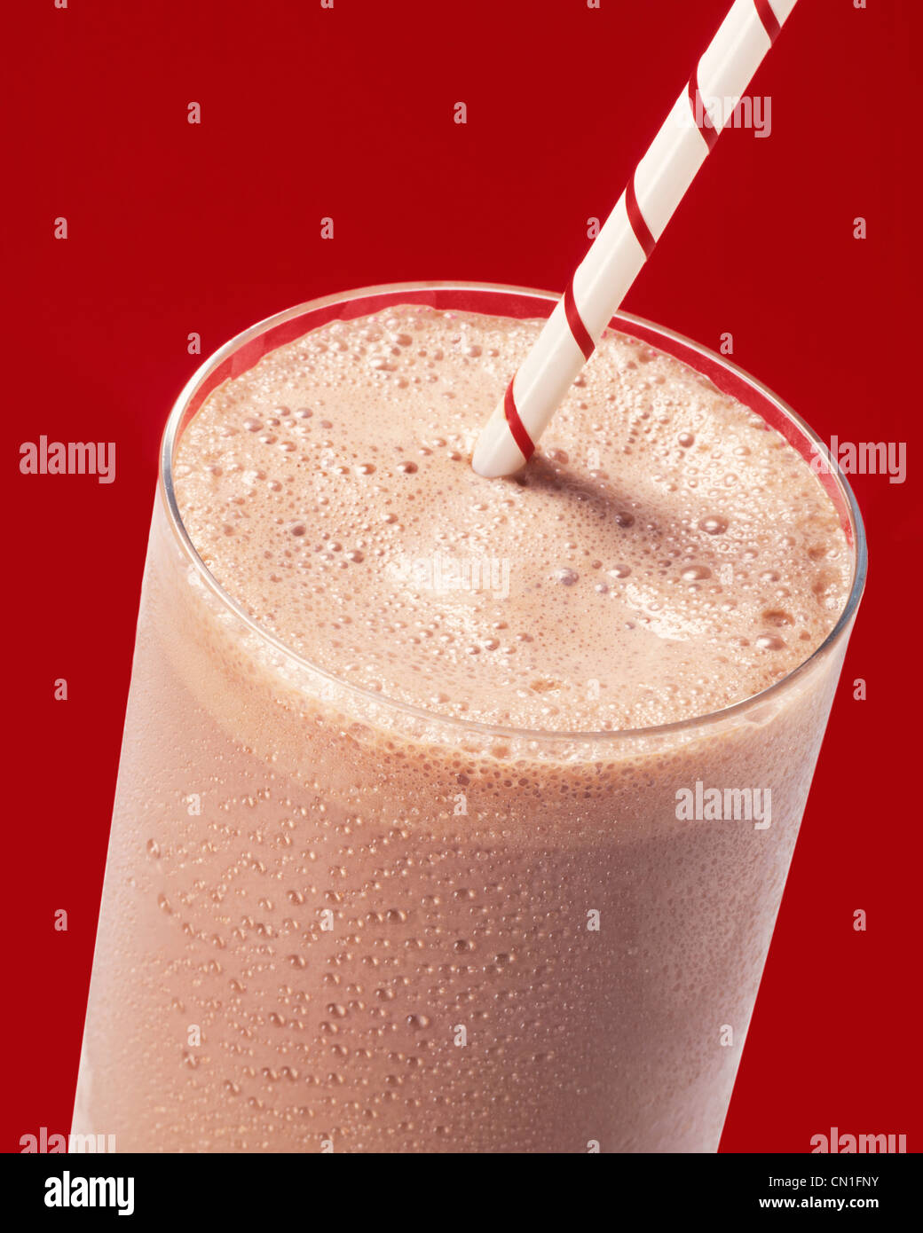 Chocolate Milkshake on Red Background Stock Photo - Alamy