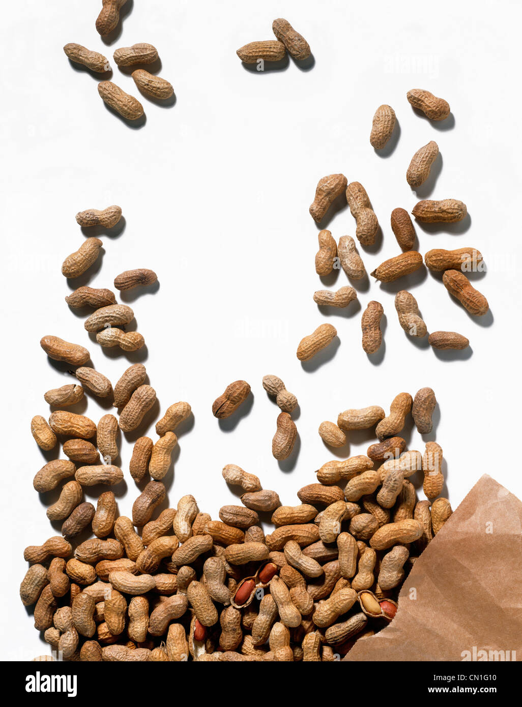 Peanuts Scattering Out of Paper Bag Stock Photo - Alamy
