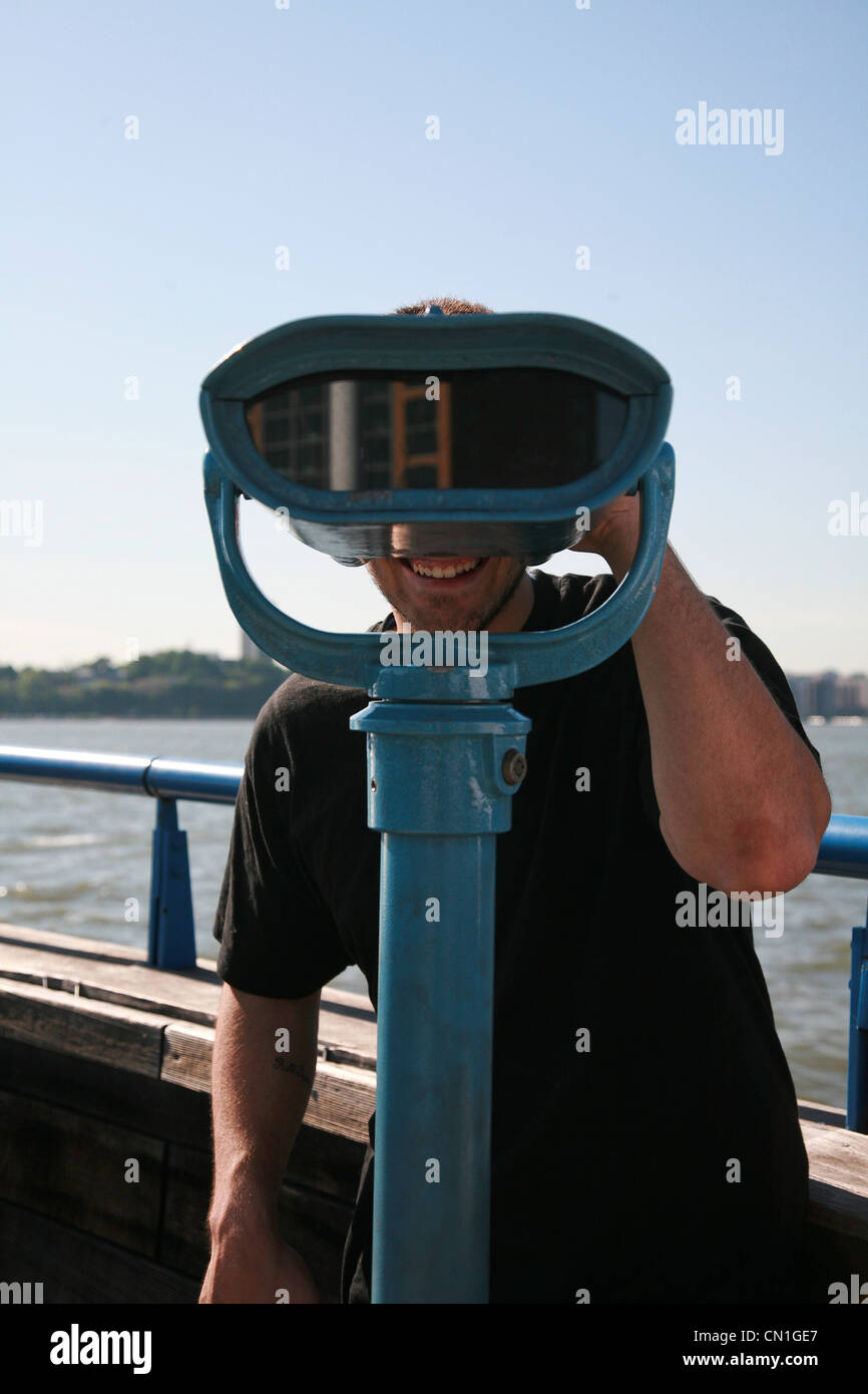 Man Looking Through Binocular Viewer Stock Photo - Alamy