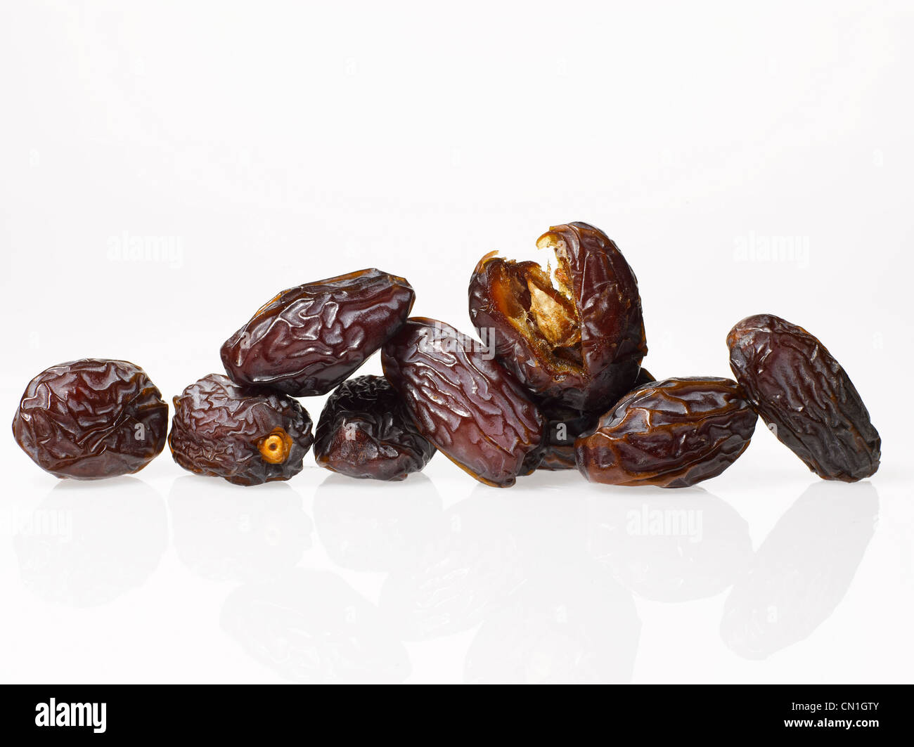 Several Medjool Dates on White Background Stock Photo - Alamy