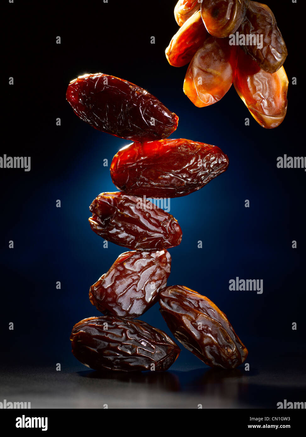 Stacked Medjool Dates on Dark Blue Background Stock Photo - Alamy