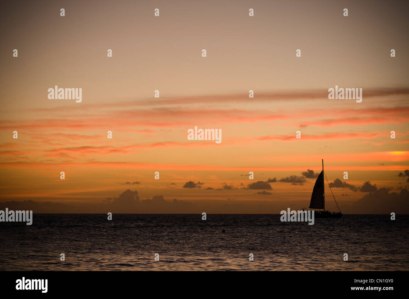 Sailboat at Sunset Stock Photo - Alamy