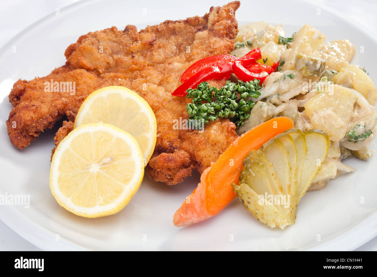 Vienna schnitzel with potato Vienna salad Stock Photo - Alamy