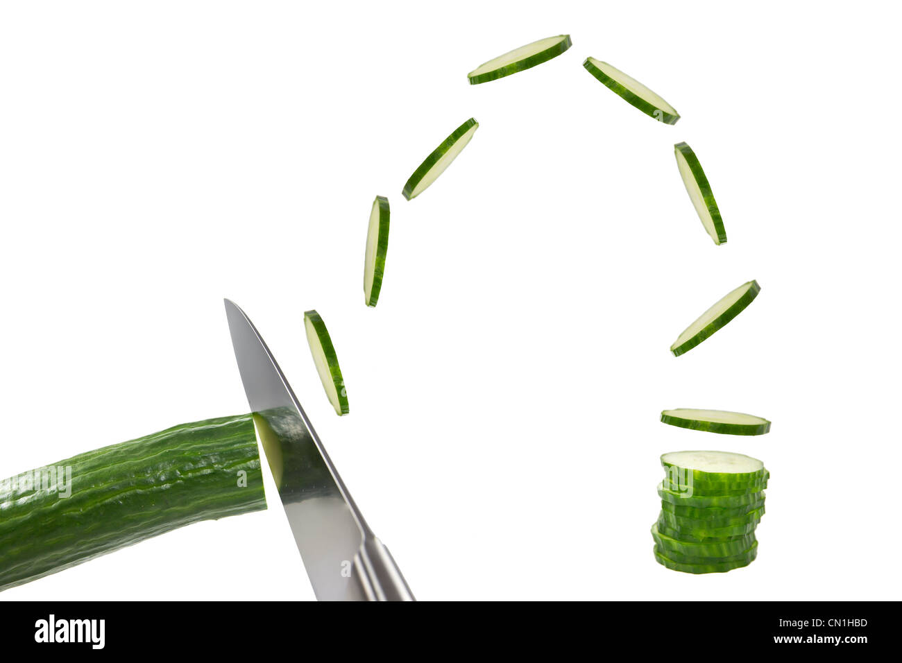 Picture of someone chopping up cucumbers really fast and placing them ...