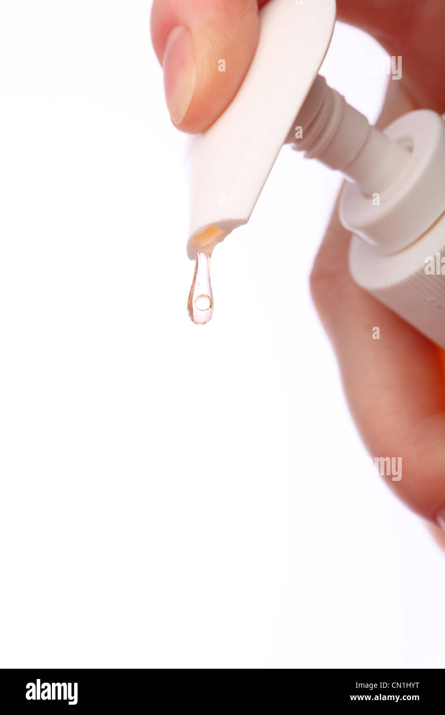 Applying liquid soap.hand holding bottle with liquid soap isolated on ...
