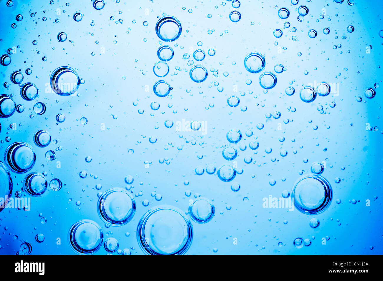 Bubbles in Blue Liquid Stock Photo - Alamy