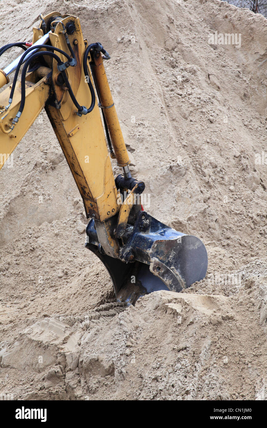 bucket digger of an earthmover on sand background Stock Photo - Alamy