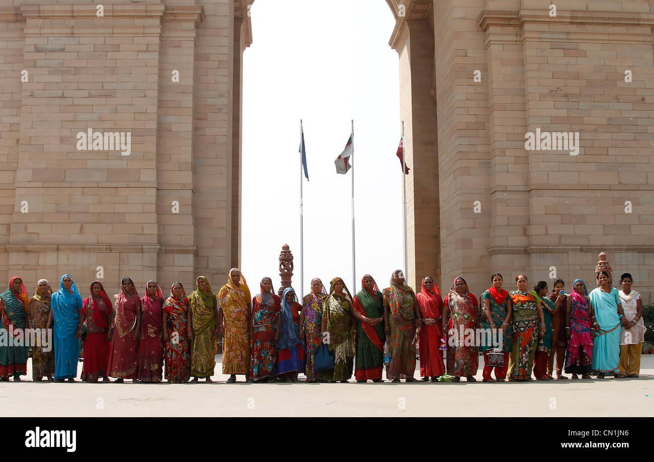 Group of Indian tourist in Traditional Dress visit India gate in Delhi ...