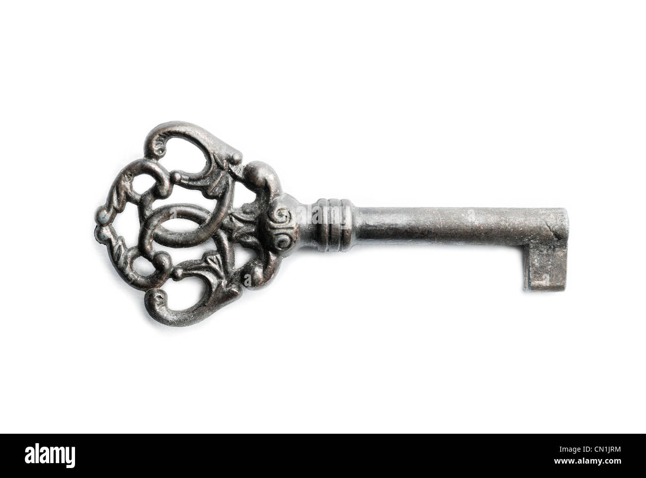 An old ornate key isolated on white background Stock Photo - Alamy