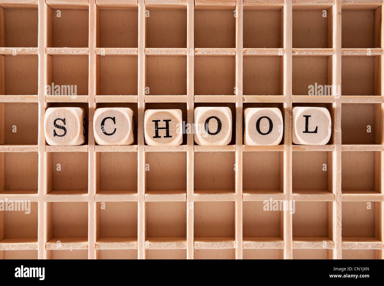 School word construction with letter blocks / cubes and a shallow depth ...