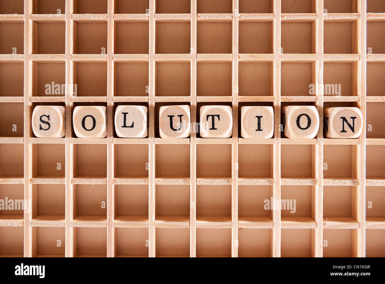 Solution word construction with letter blocks / cubes and a shallow ...