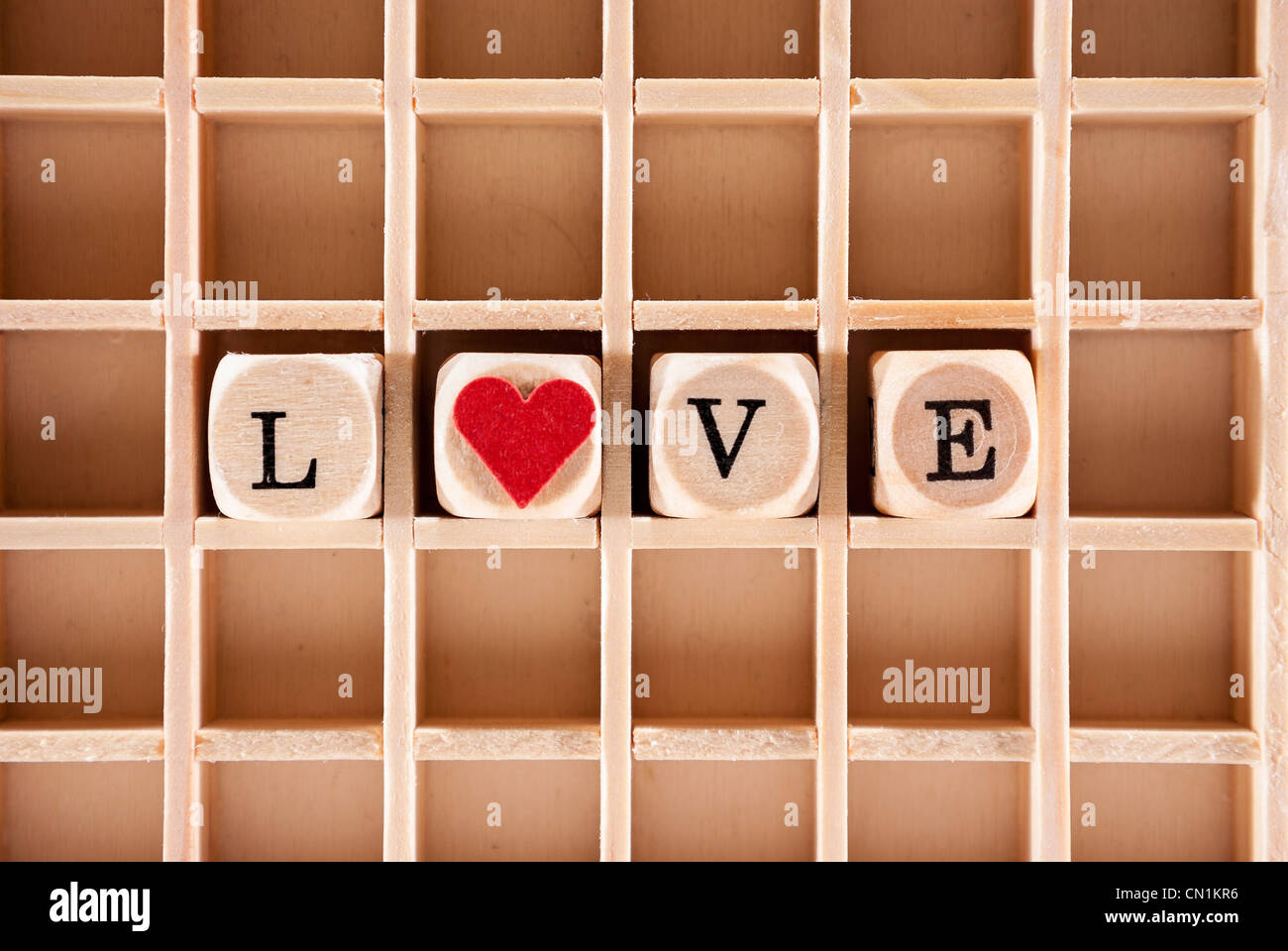 love word construction with letter blocks / cubes, a heart and a ...