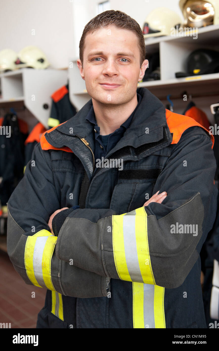 Picture from a young and successful firefighter at work Stock Photo - Alamy