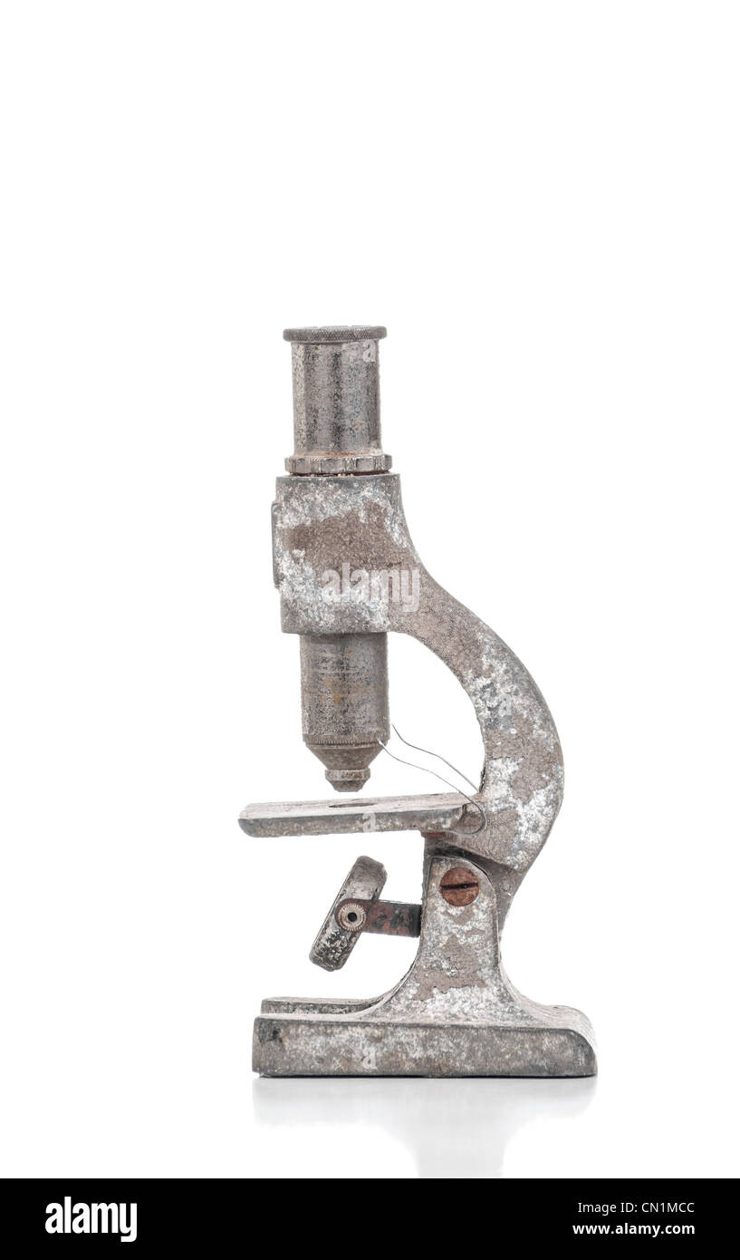 An old weathered microscope on a white background Stock Photo - Alamy