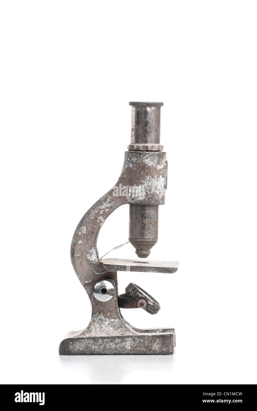 An old weathered microscope on a white background Stock Photo - Alamy