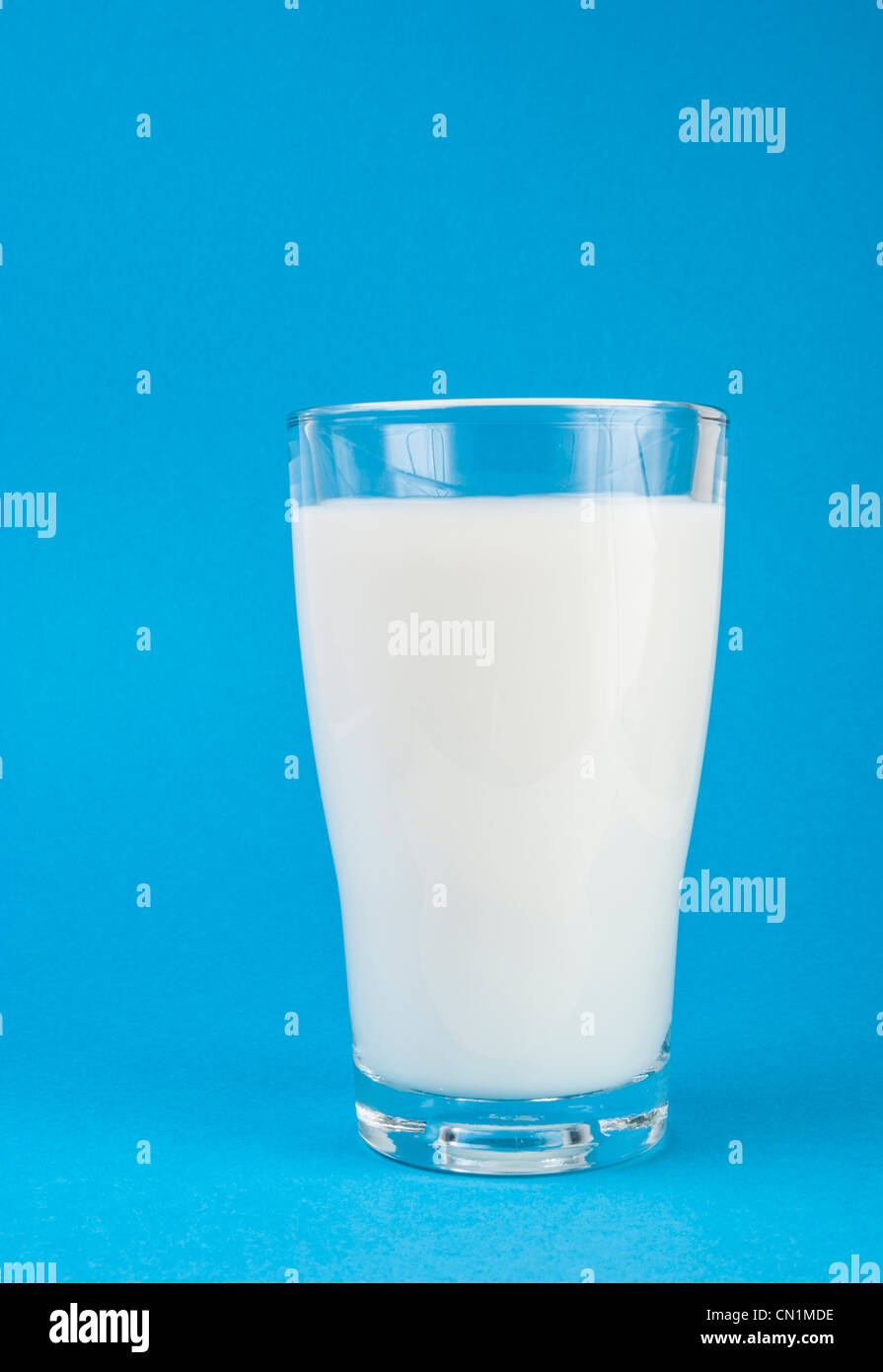 A milk cup over a color background Stock Photo - Alamy