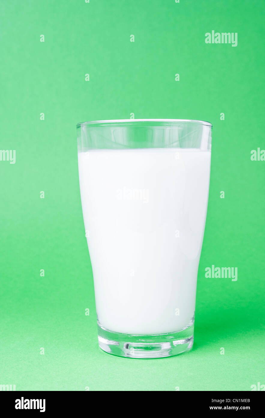 A milk cup over a color background Stock Photo - Alamy