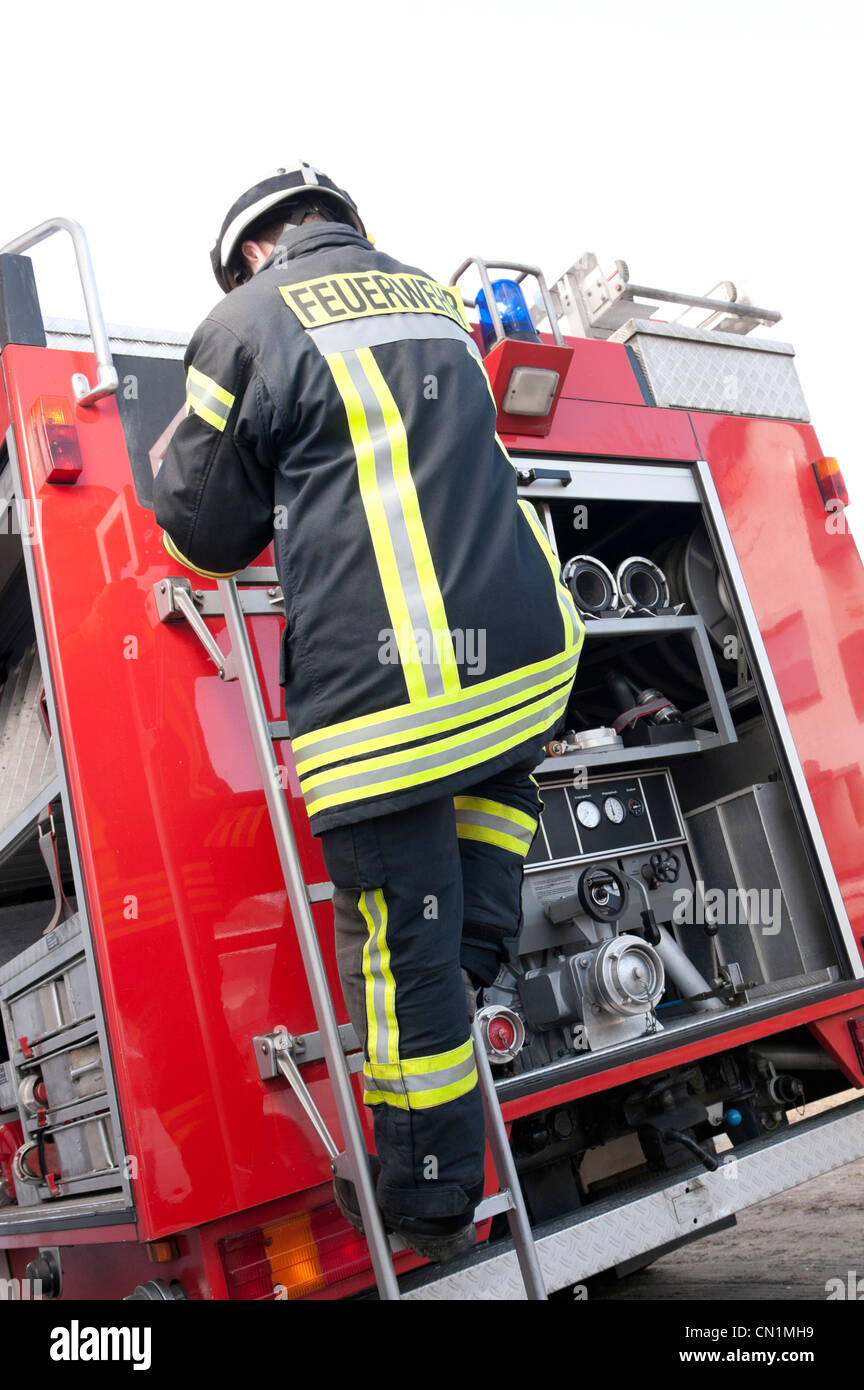 Picture from a young and successful firefighter at work Stock Photo - Alamy