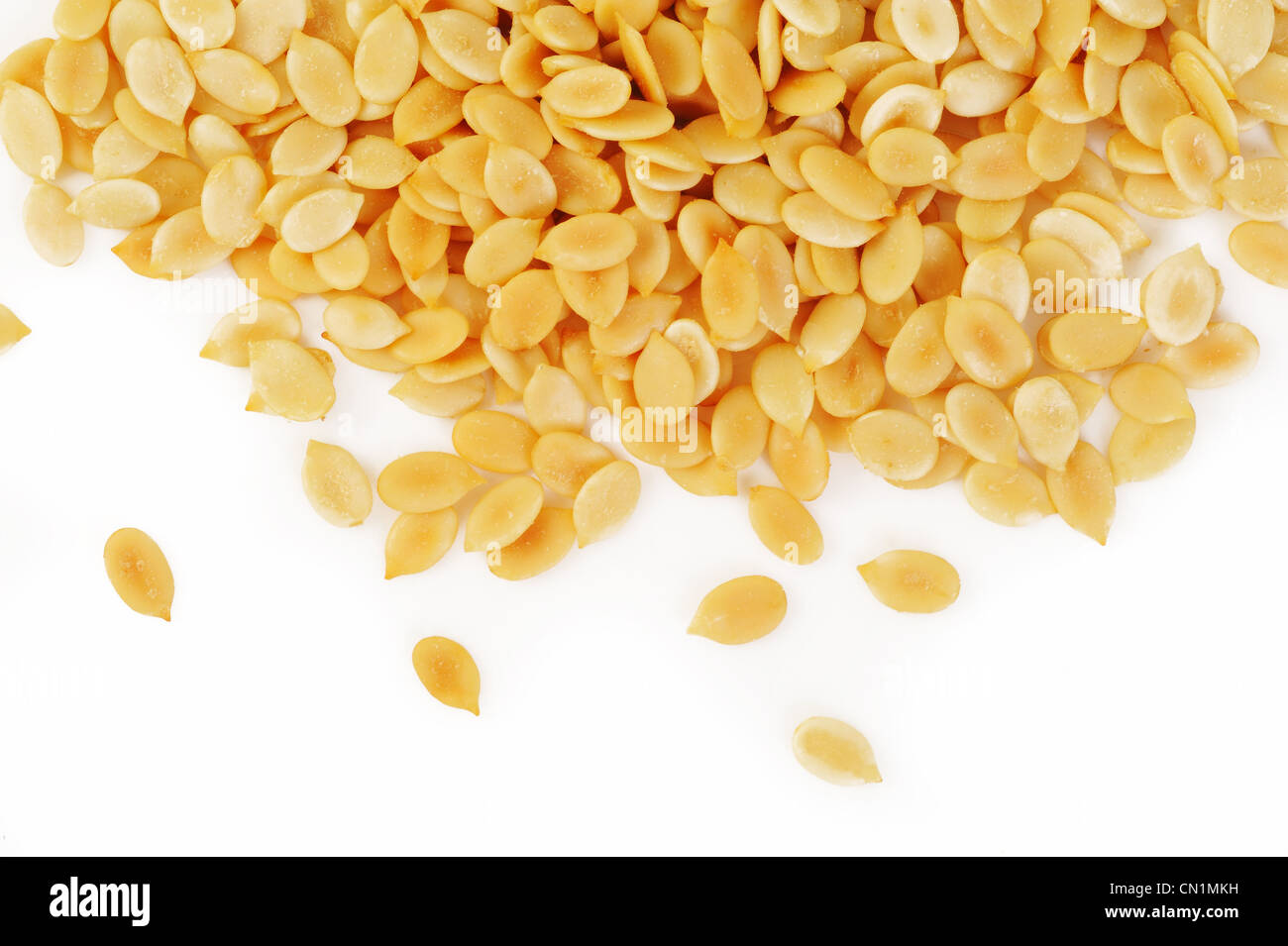 Roasted watermelon seeds with salt on white background Stock Photo - Alamy