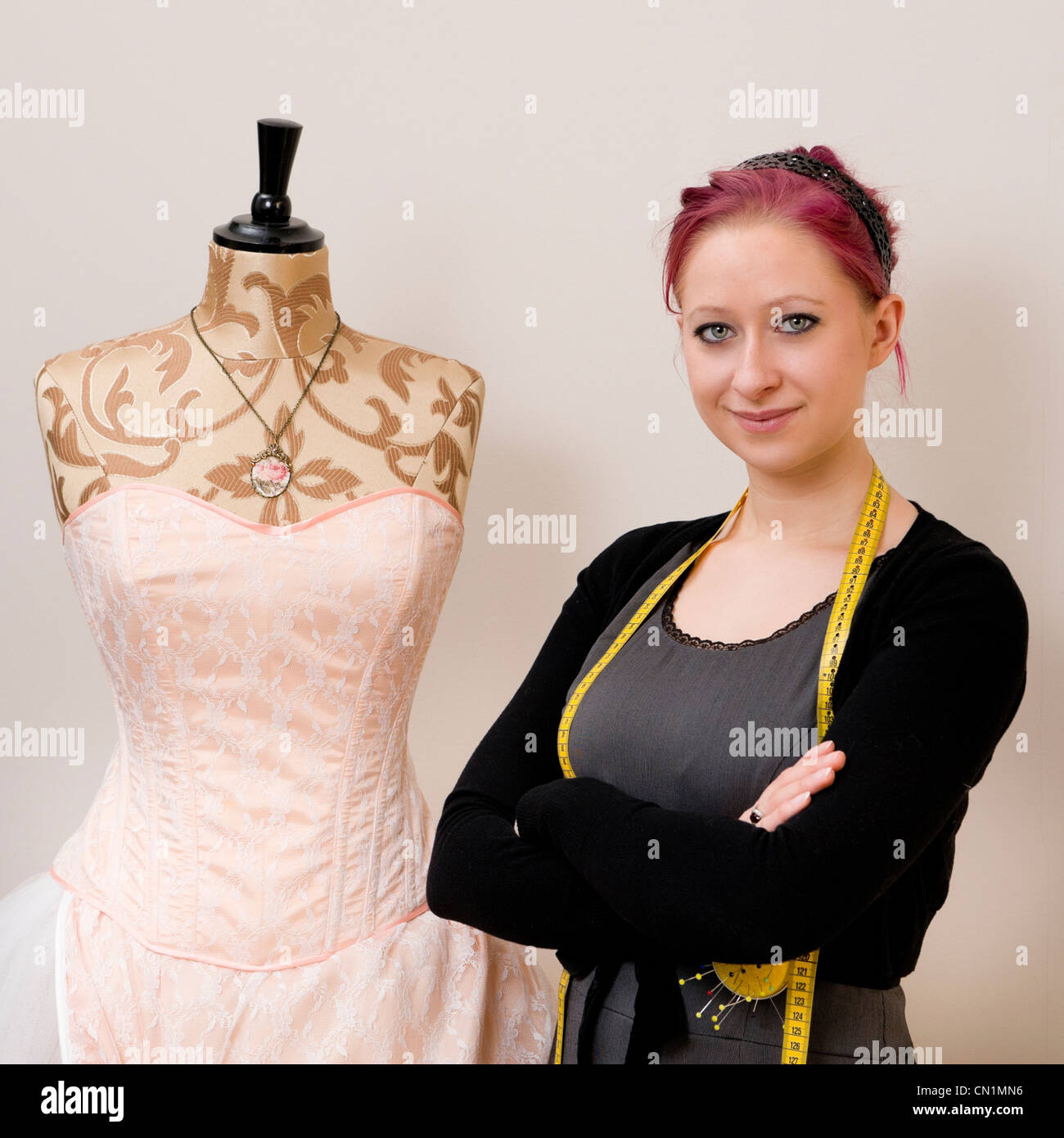 Young dressmaker in her studio Stock Photo - Alamy