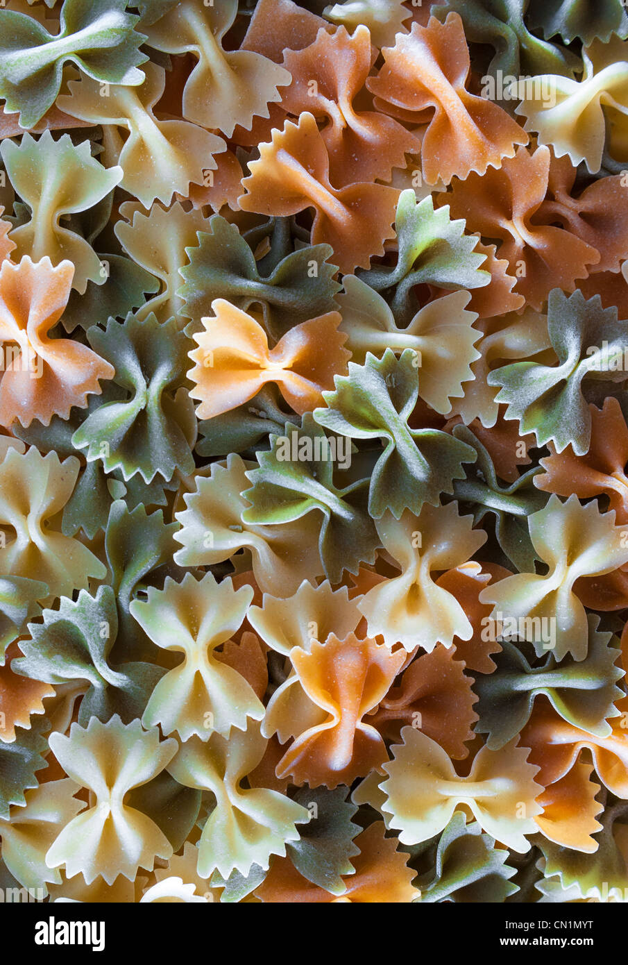 Italian colorful farfalle pasta pattern as a background Stock Photo - Alamy