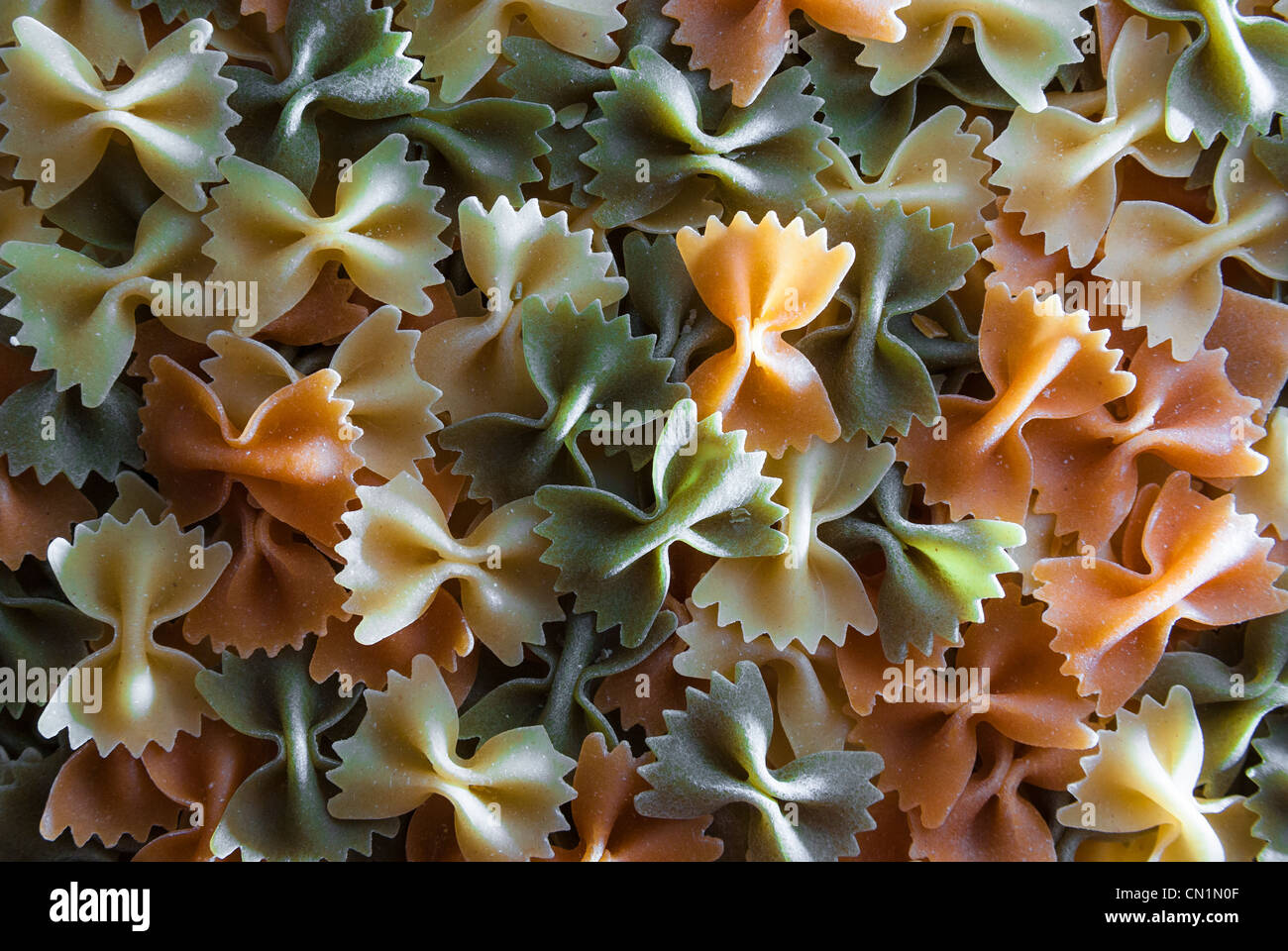 Italian colorful farfalle pasta pattern as a background Stock Photo - Alamy