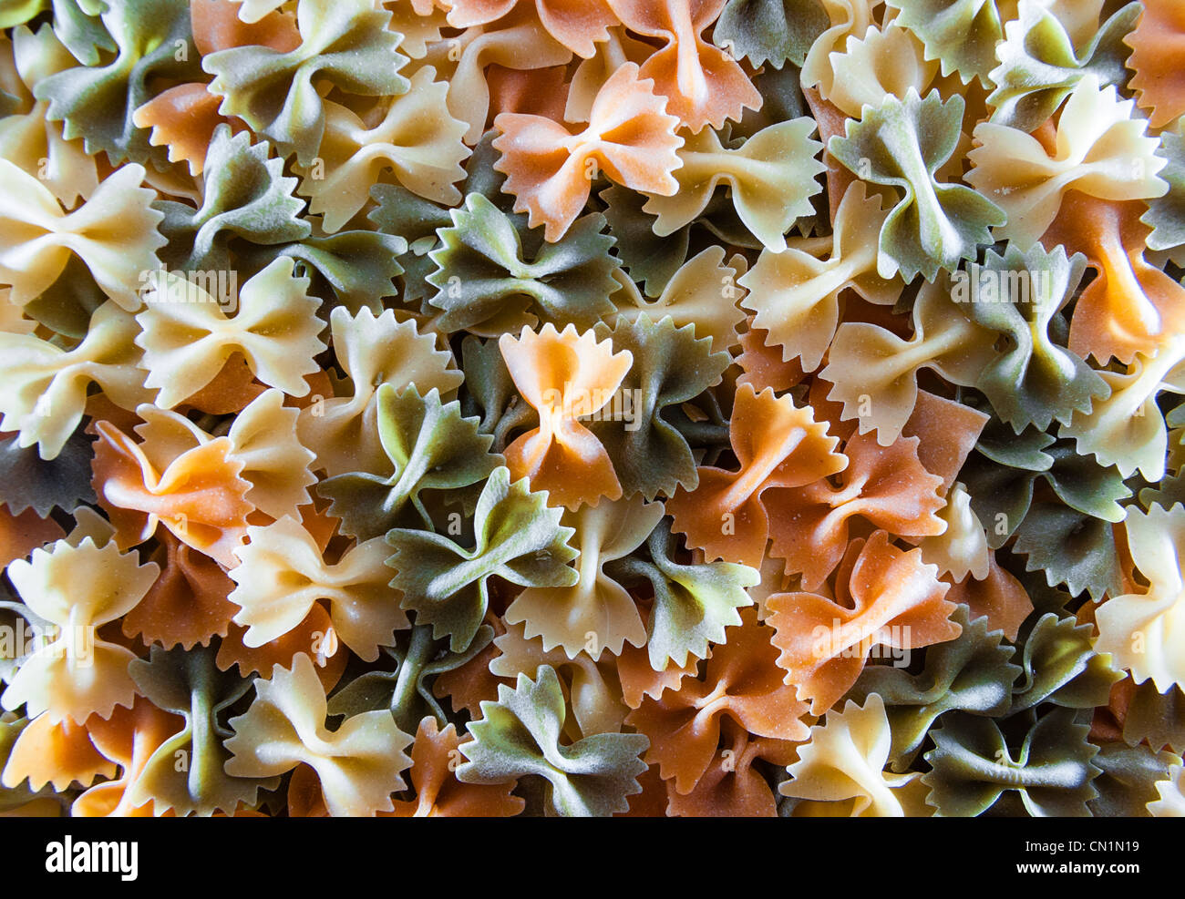 Italian colorful farfalle pasta pattern as a background Stock Photo - Alamy