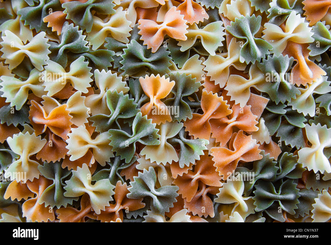 Italian colorful farfalle pasta pattern as a background Stock Photo - Alamy