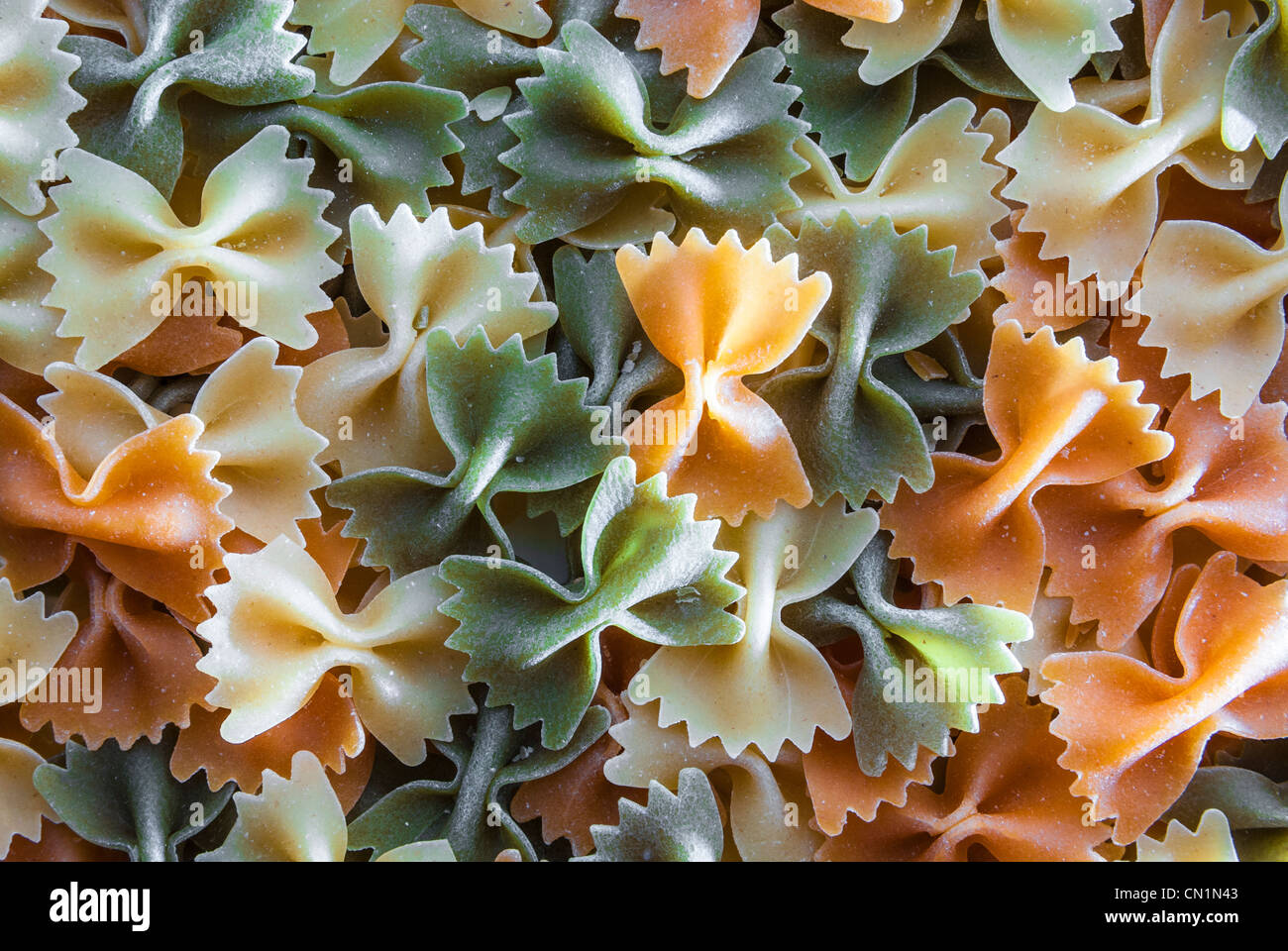 Italian colorful farfalle pasta pattern as a background Stock Photo - Alamy