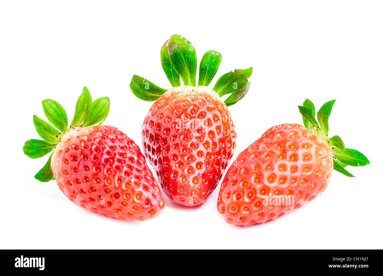 Strawberry fruits on a white background Stock Photo - Alamy