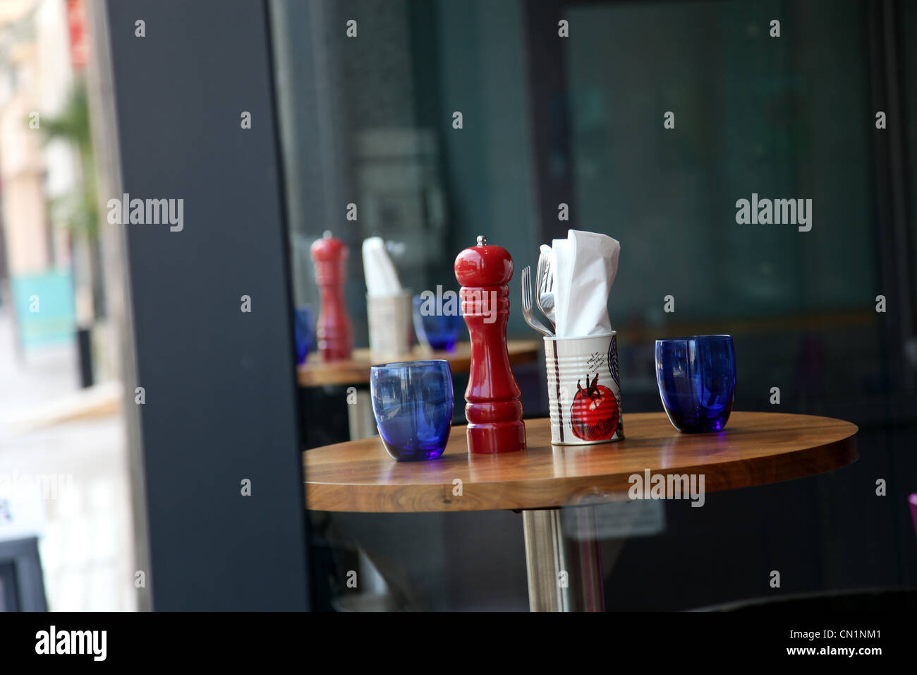 restaurant table with pepper pot and serviette Stock Photo - Alamy