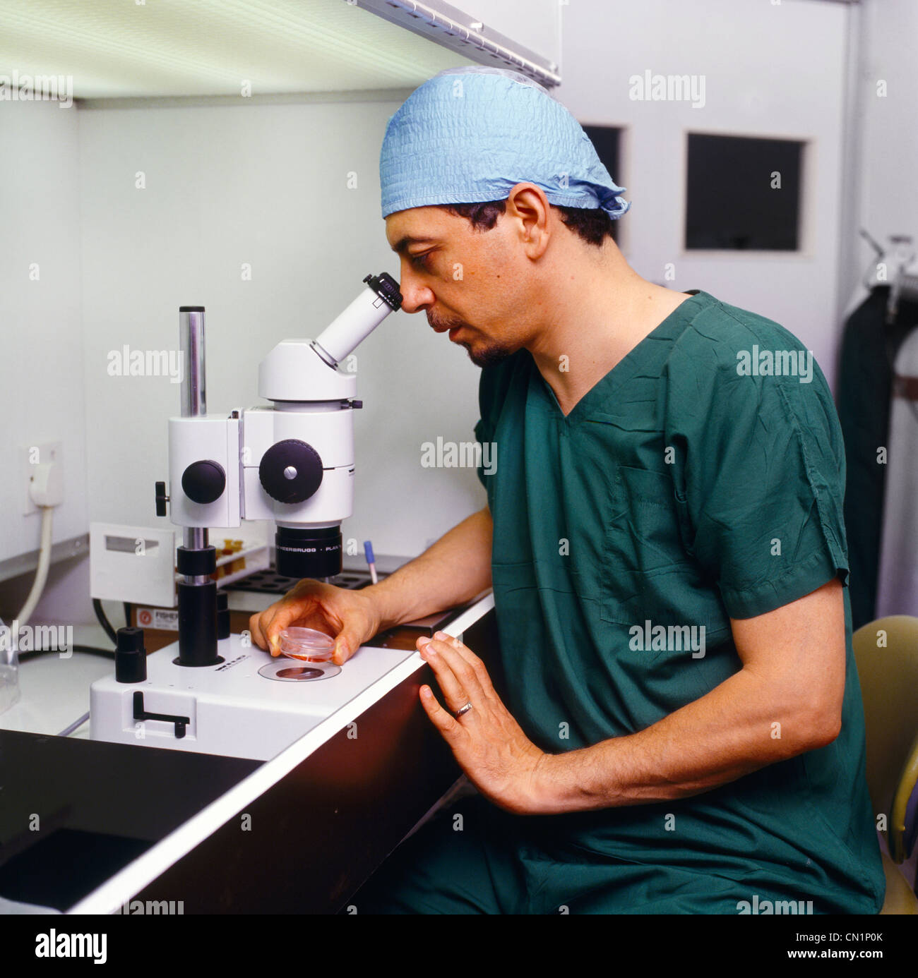 Saudi Arabia Dr Samir Abbas - Saudi Doctor Using Microscope Stock Photo ...