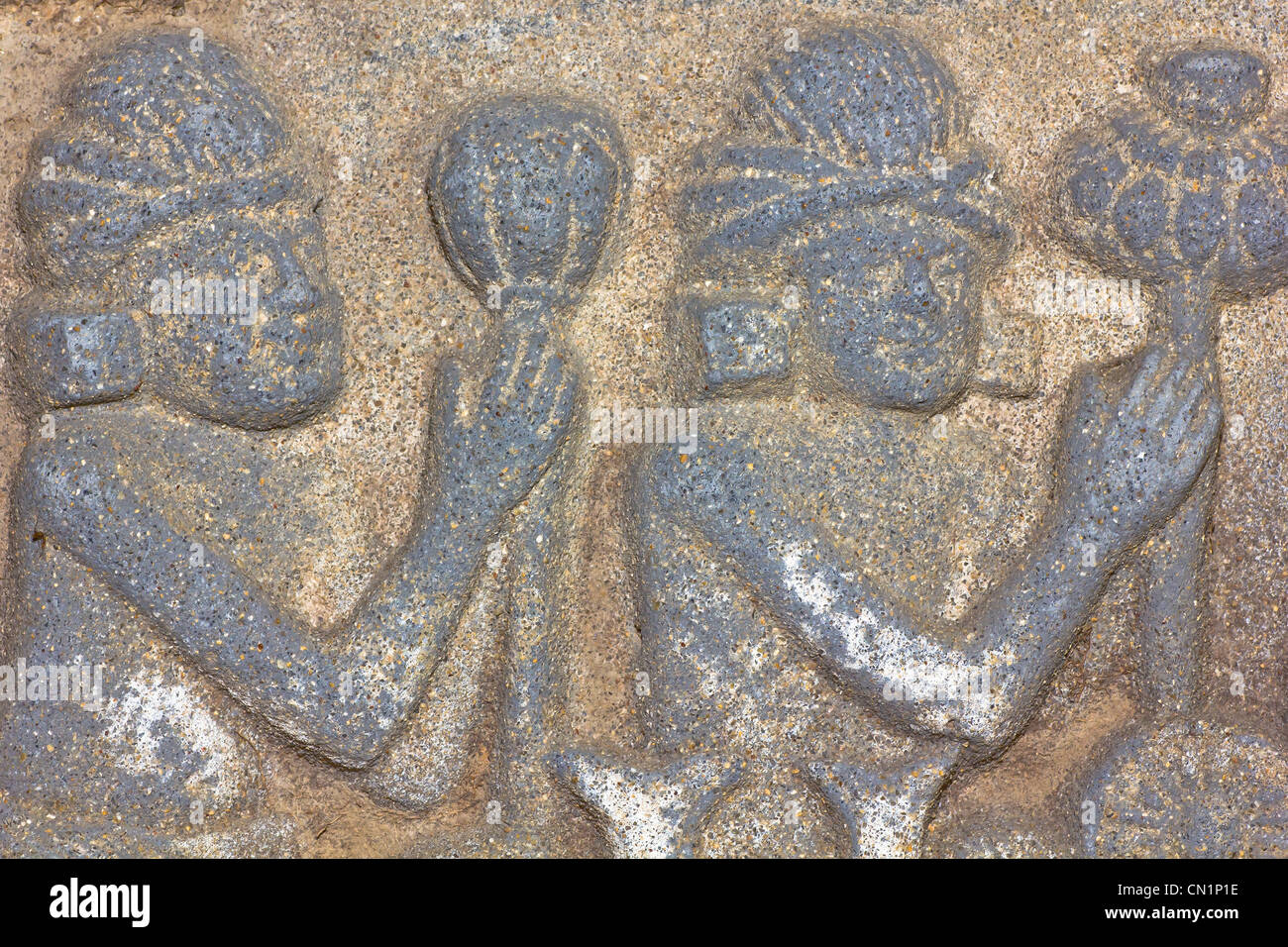 Native art carved on the wall in the temple Stock Photo - Alamy