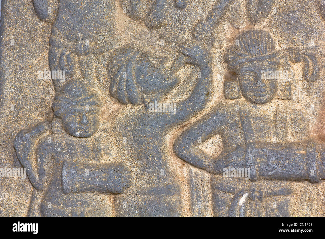 Native art carved on the wall in the temple Stock Photo - Alamy