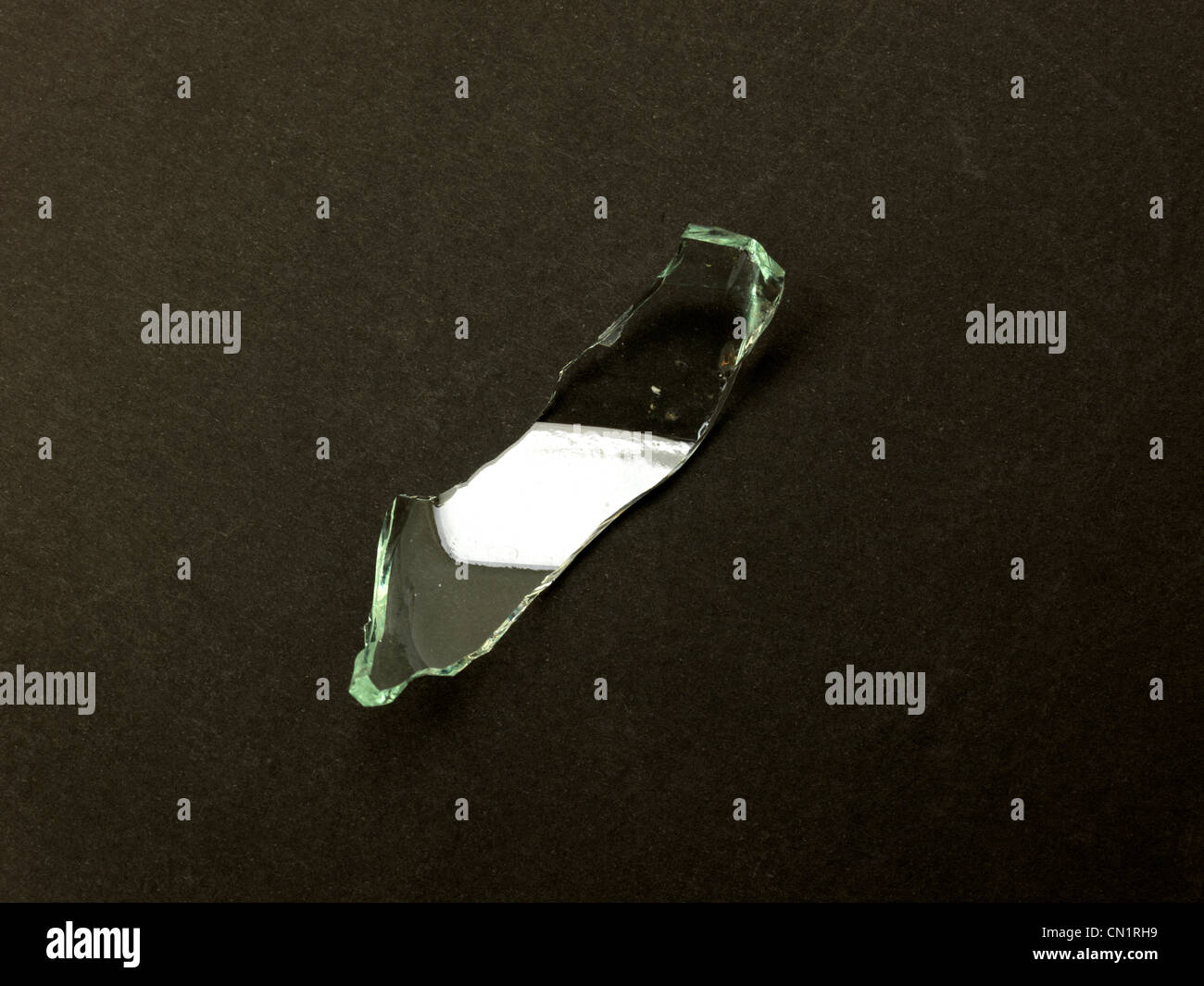 A Sharp Piece Of Broken Glass Stock Photo - Alamy