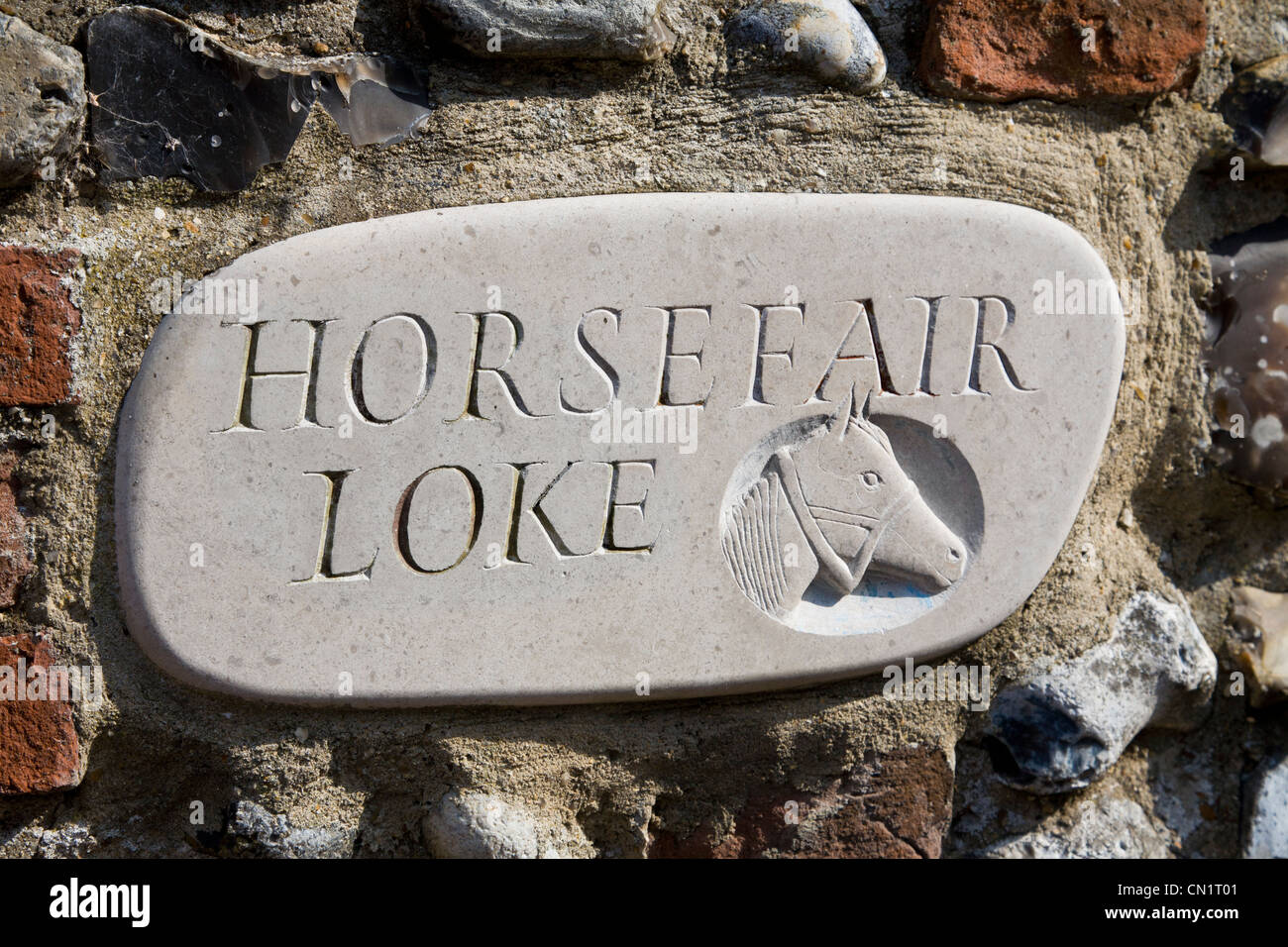 The Horsefair Loke sign mounted onto the flint and brick wall in near ...