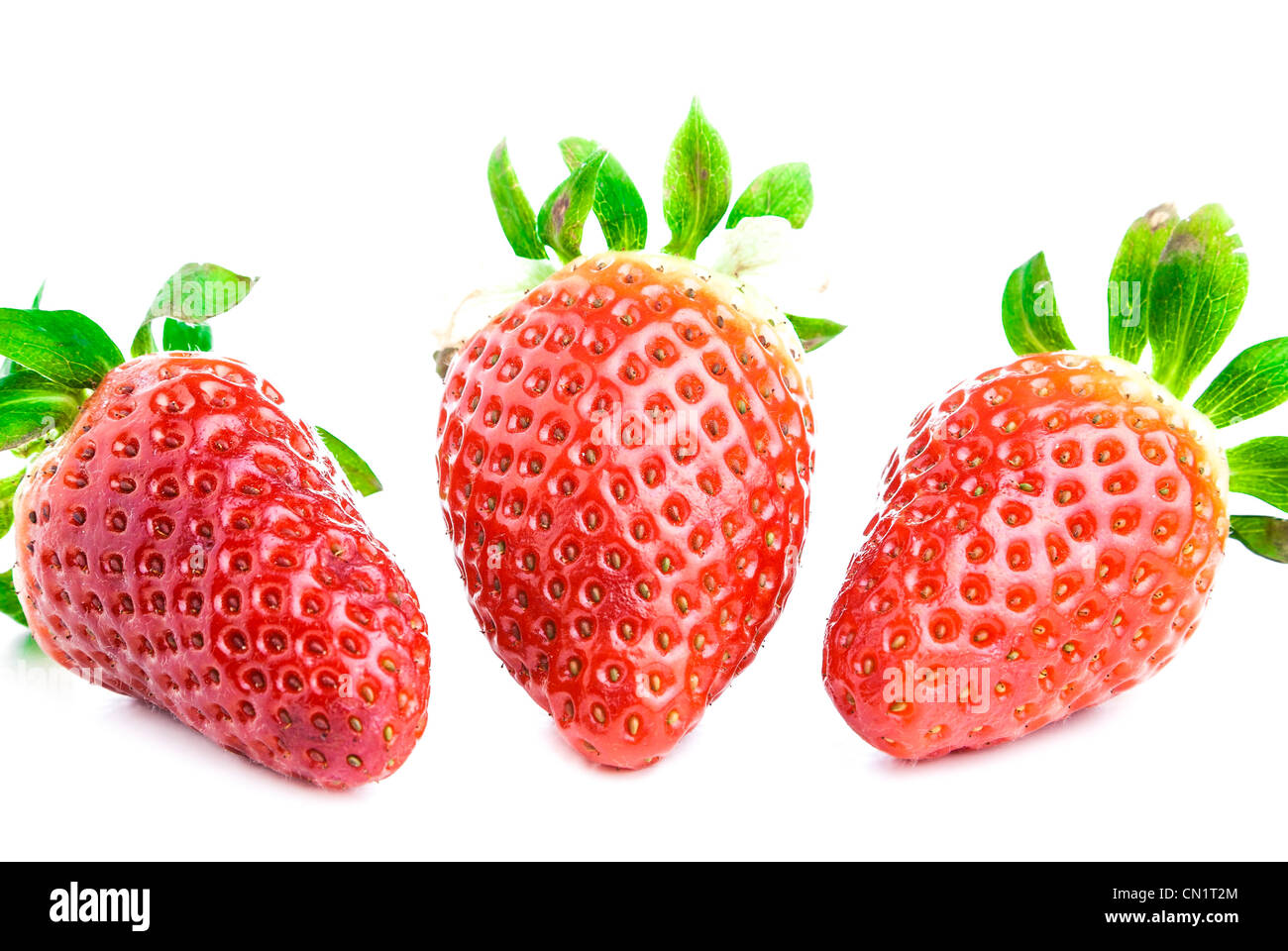 Strawberry fruits on a white background Stock Photo - Alamy