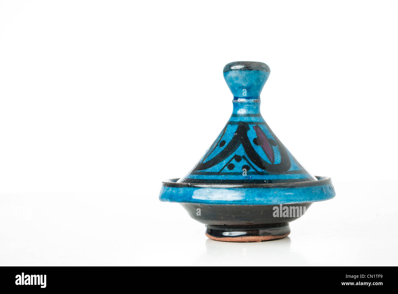 A moroccan handmade ceramic Tajine isolated on a white background Stock ...