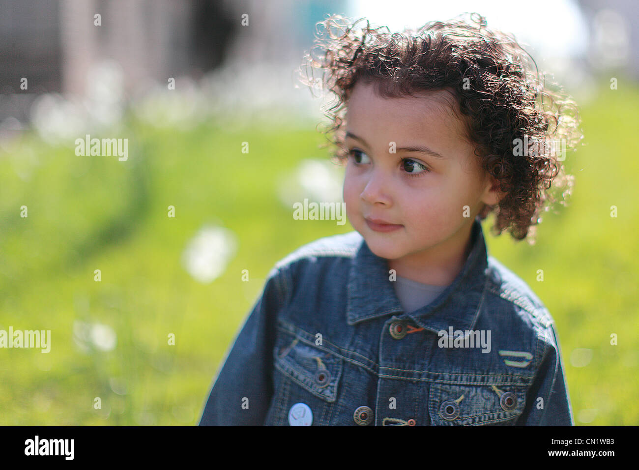 Girl in Denim Jacket smiling Spring Stock Photo - Alamy
