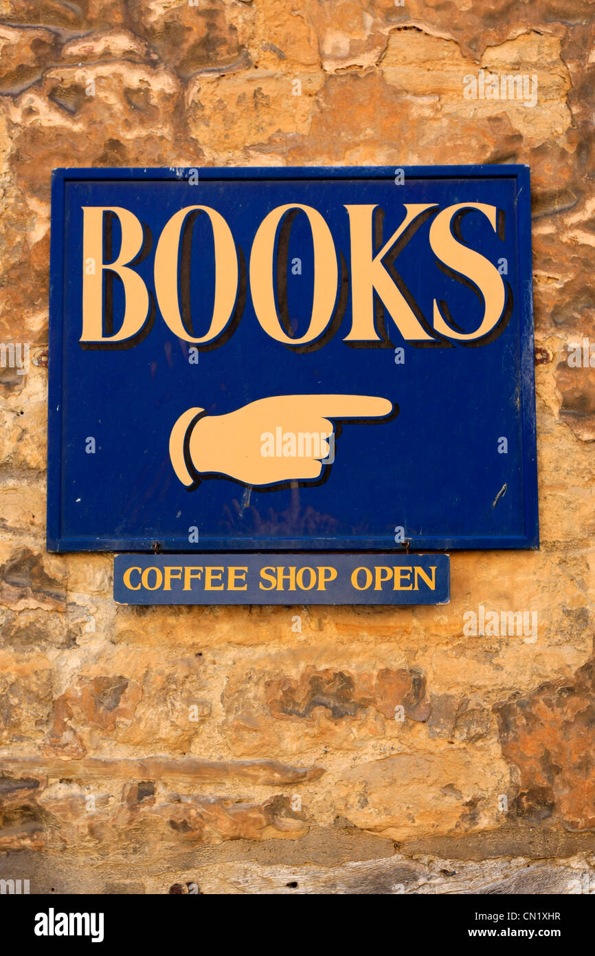 Books Sign with a hand pointing to the left Stock Photo - Alamy