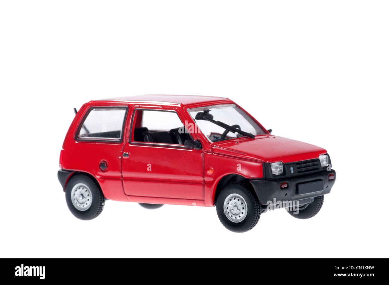 Small red car on white background Stock Photo - Alamy