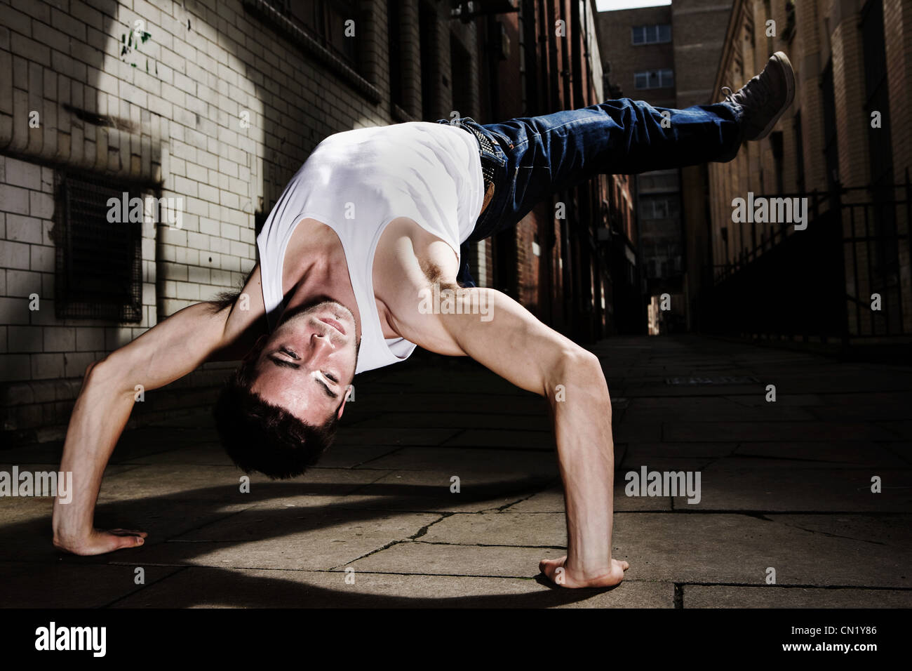 Young man breakdancing Stock Photo - Alamy