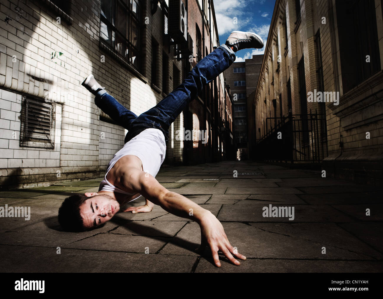 Young man breakdancing Stock Photo - Alamy
