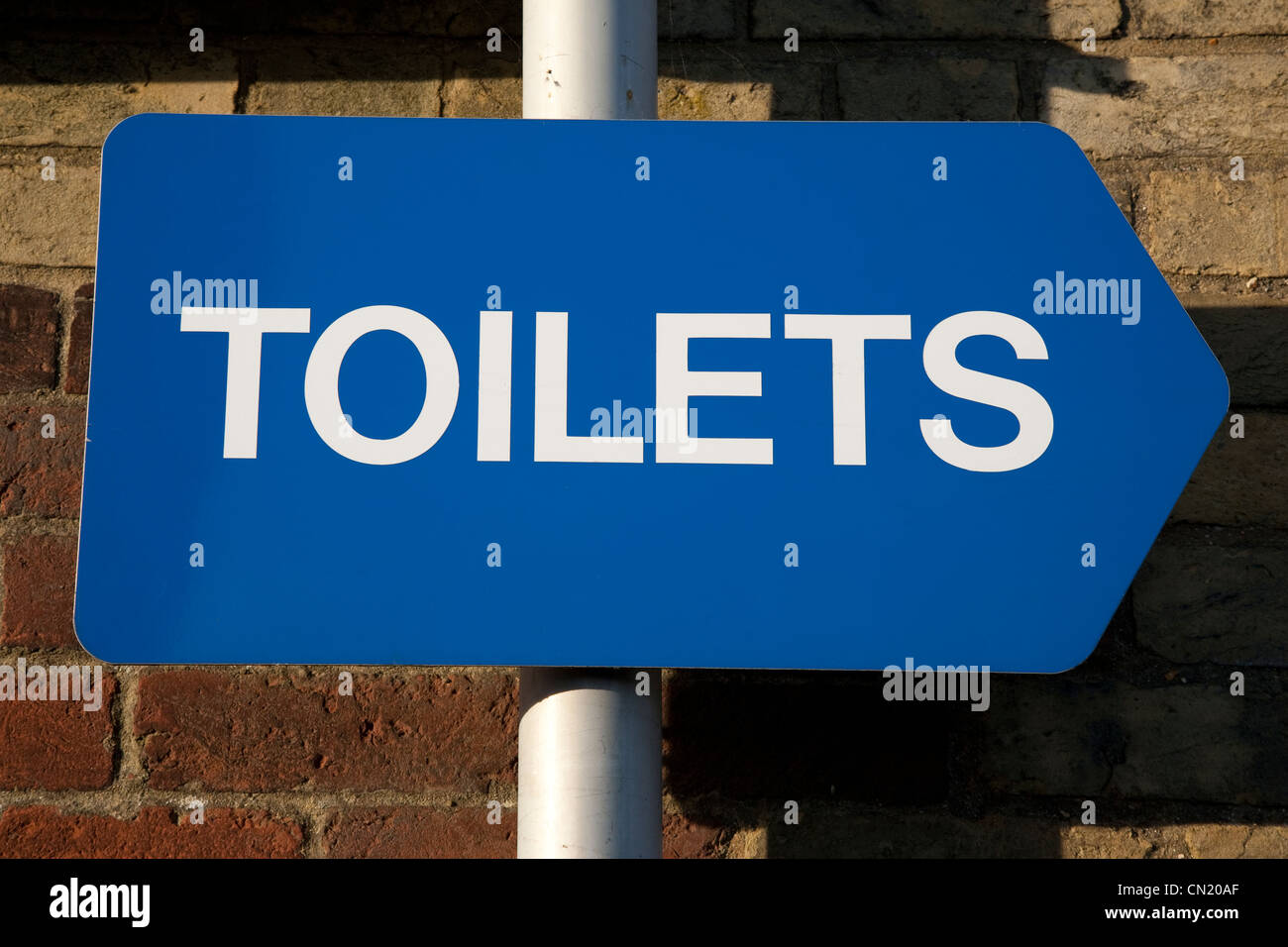 Blue toilet sign brick wall wc loo hi-res stock photography and images ...