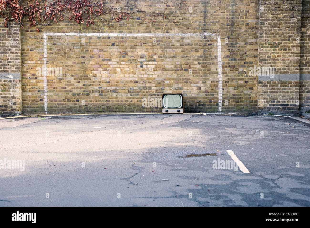 Retro television in football goal painted on brick wall Stock Photo - Alamy