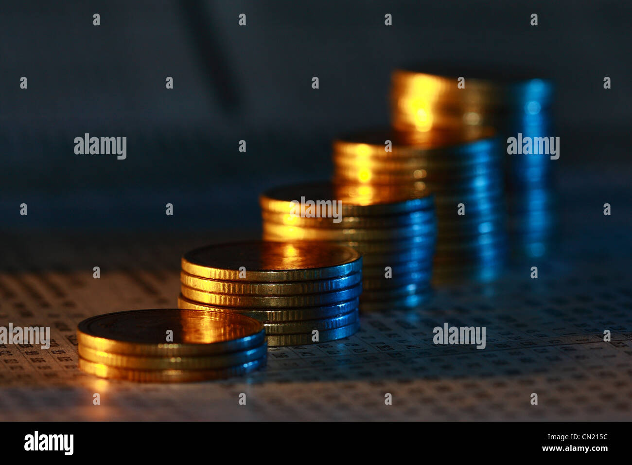 gold coin money with opposite color light Stock Photo - Alamy